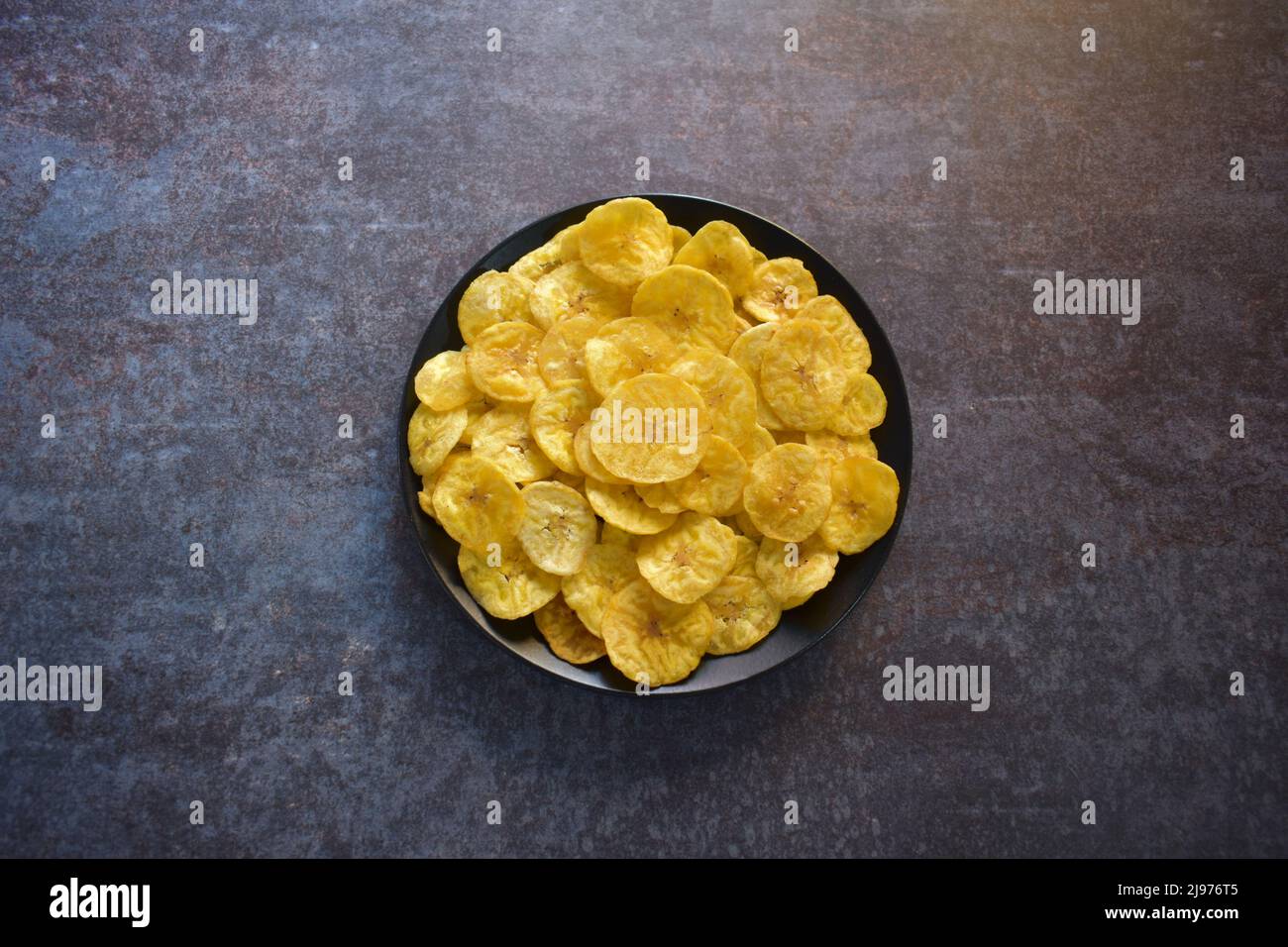 Deep fried banana chips savory snack food Stock Photo - Alamy