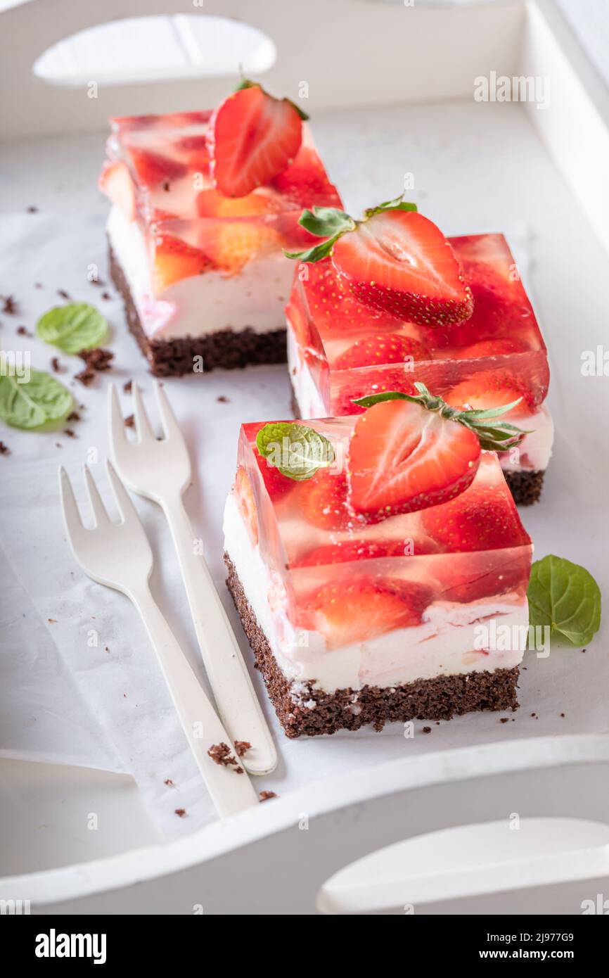 Tasty strawberry jelly cake with fluffy cream layer. Cake with jelly on ...