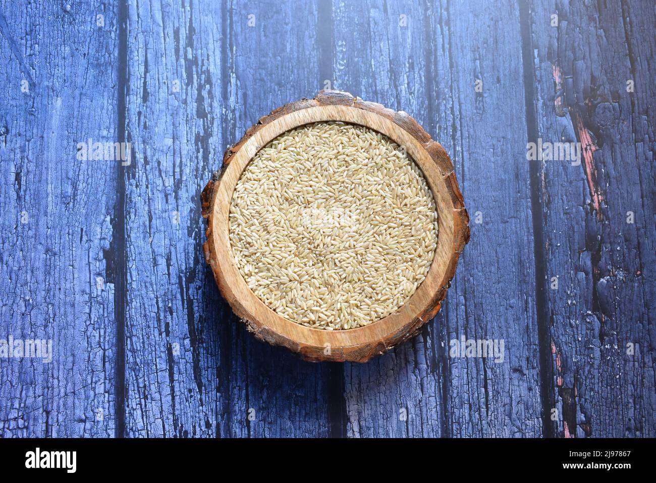 Raw whole dried brown color rice Stock Photo - Alamy