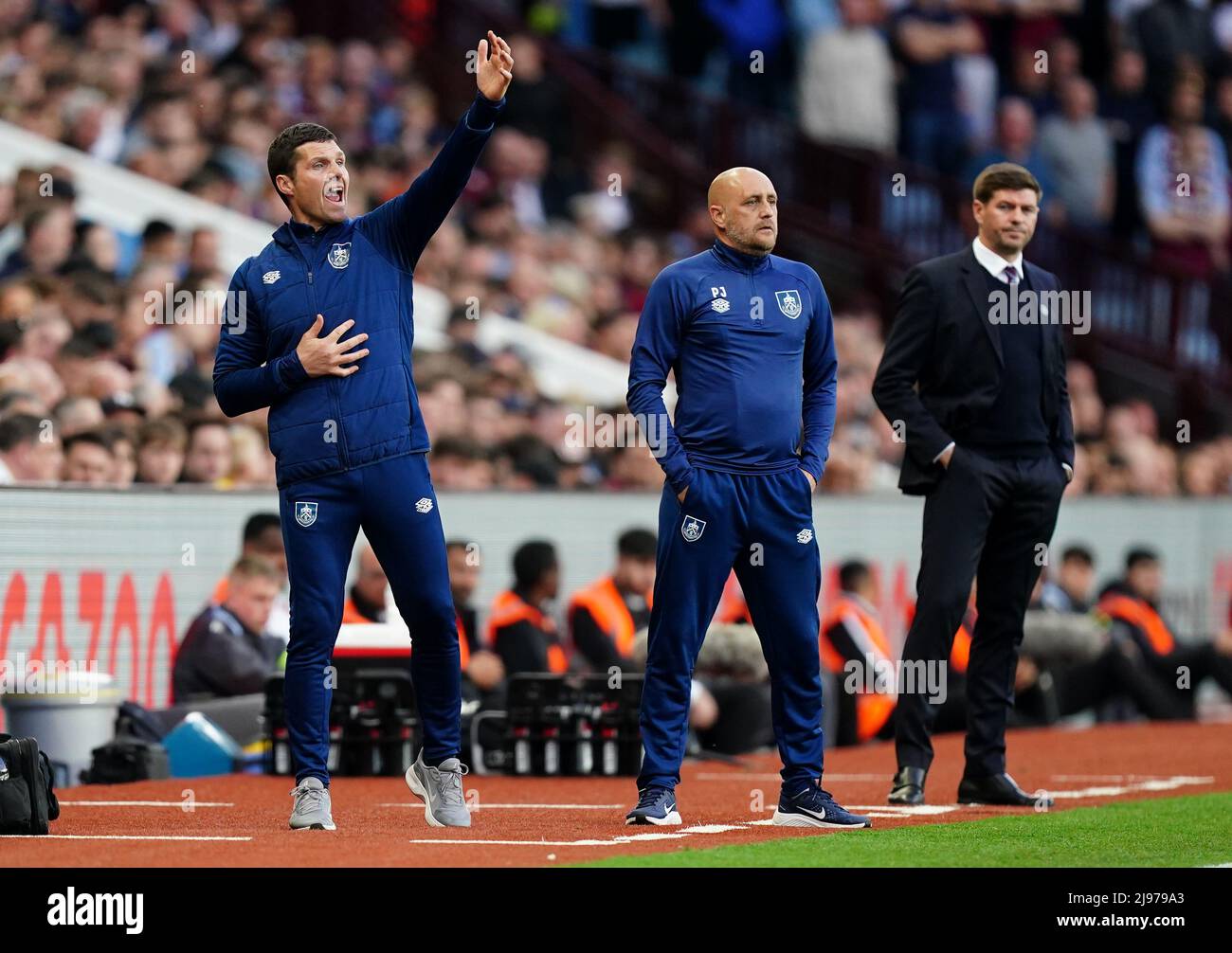 Burnley's Academy Director Paul Jenkins (centre) and caretaker manager ...