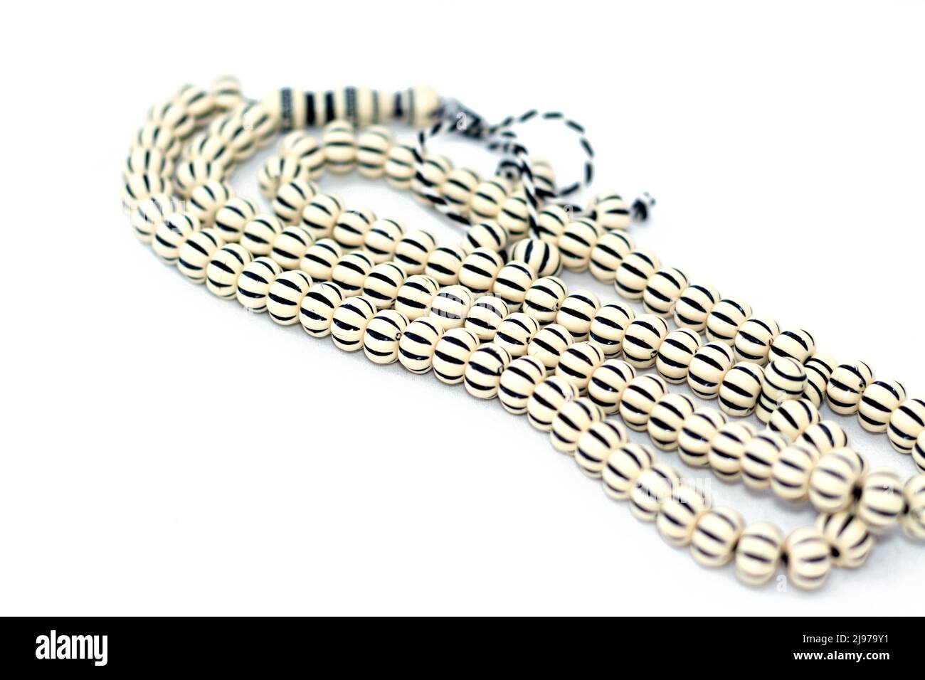 Islamic rosary in white and black stripes with 99 rosary beads that ...