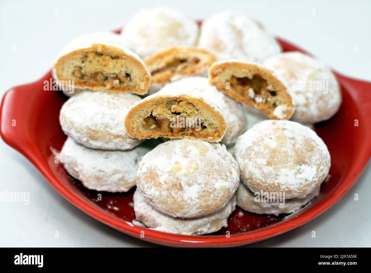 Red plate of traditional Arabic cookies for celebration of Islamic ...