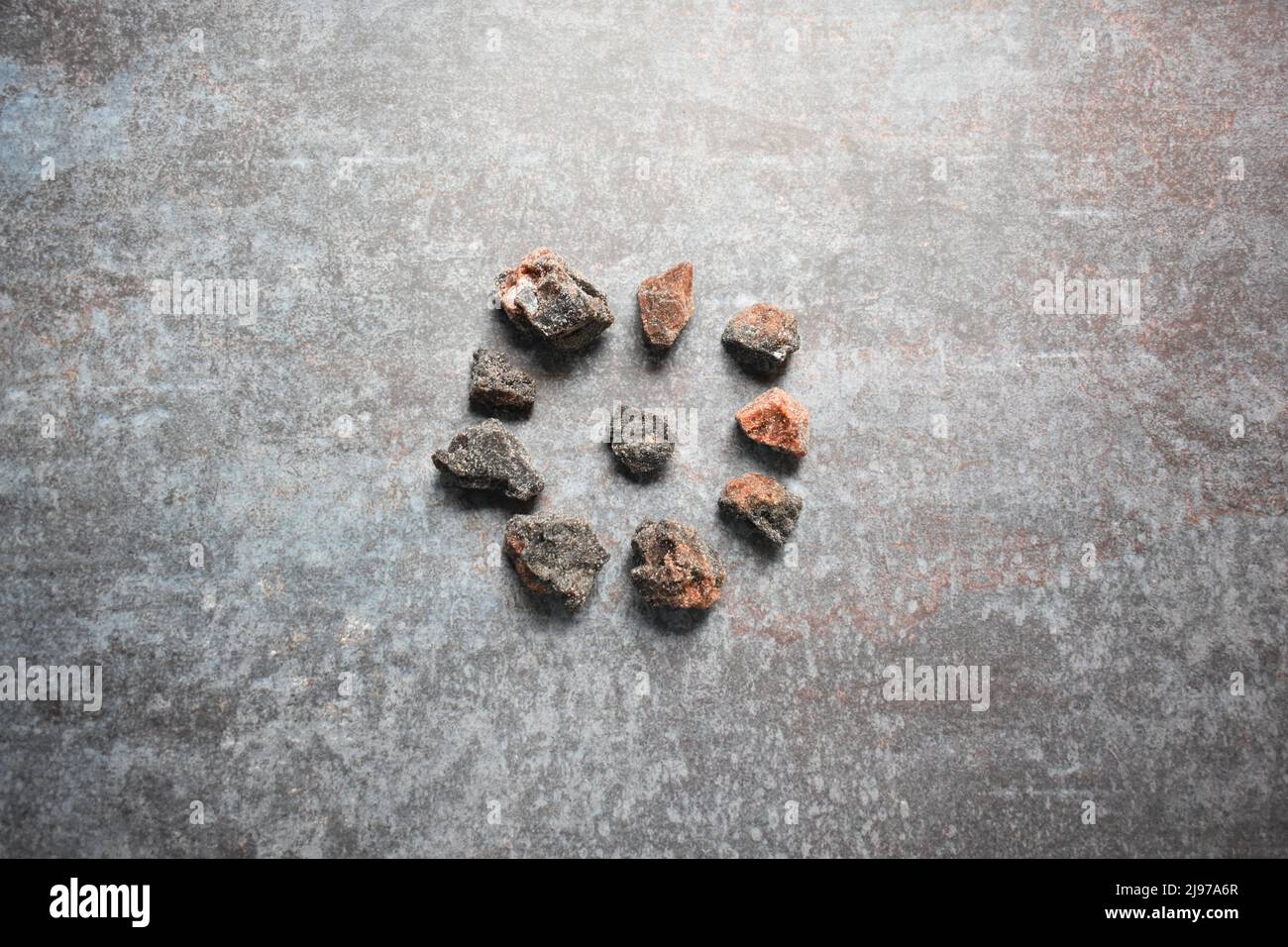 Raw whole dried black rock salt Stock Photo - Alamy