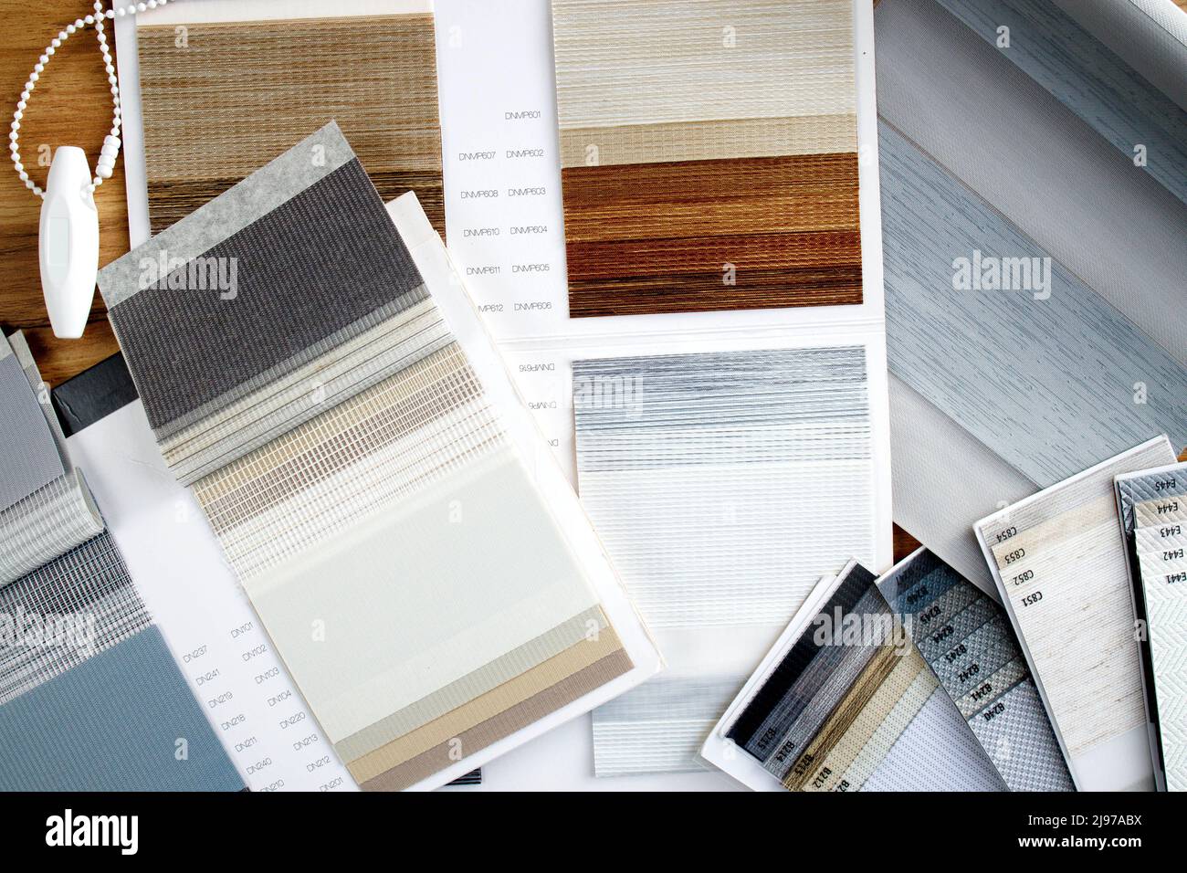 Samples of fabrics of different textures and colors in the form of a ...