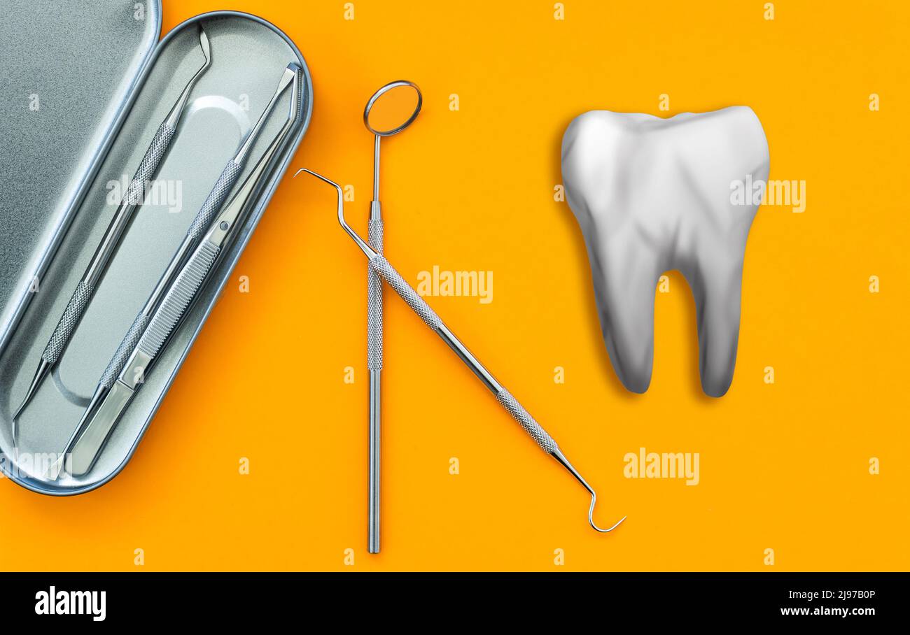 dental instrument and artificial tooth Stock Photo - Alamy