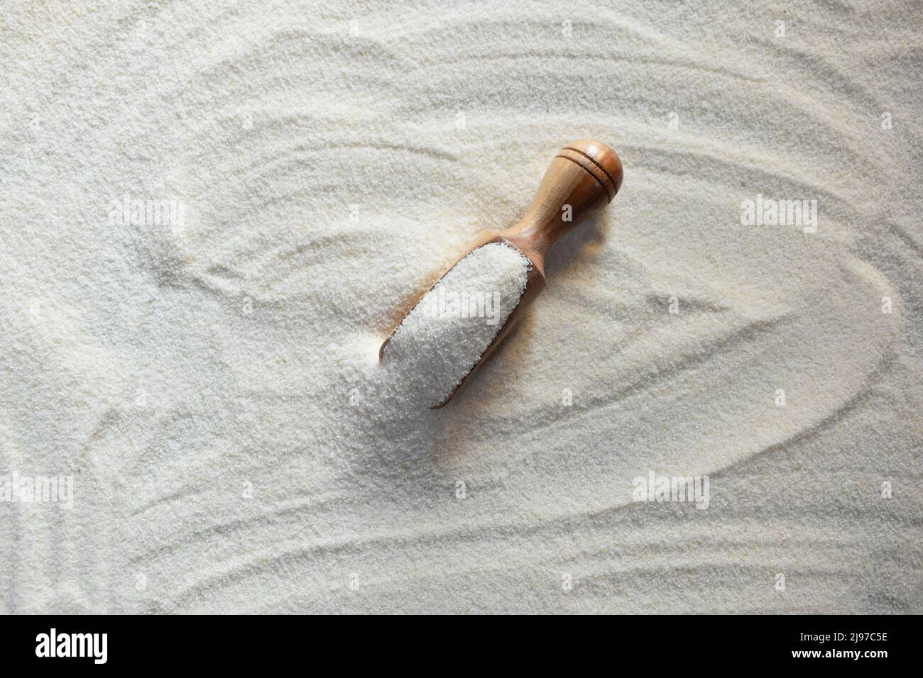 Raw coarse dried rice semolina Stock Photo - Alamy