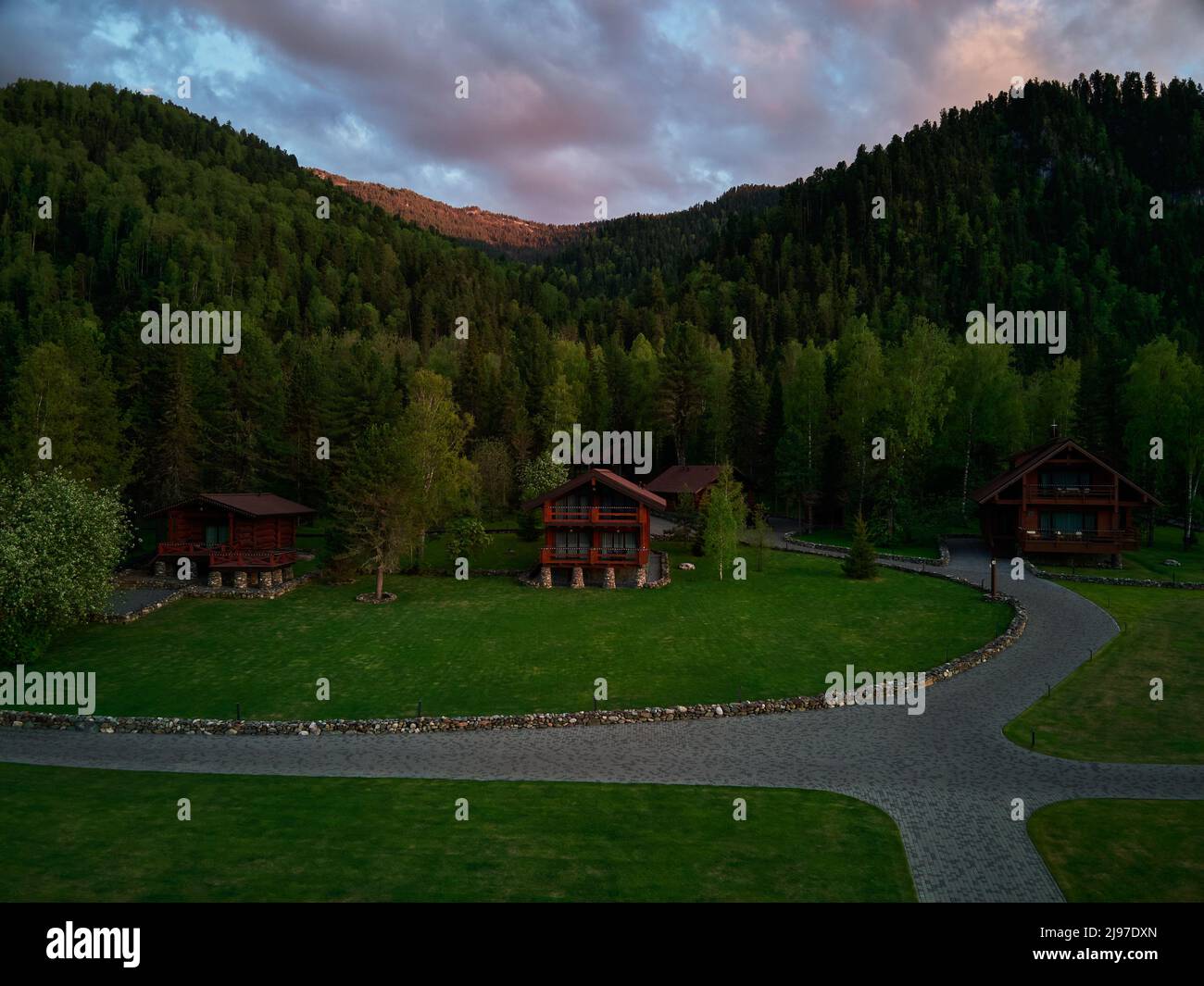 Old dark house with red windows. A terrible place on a gloomy night ...