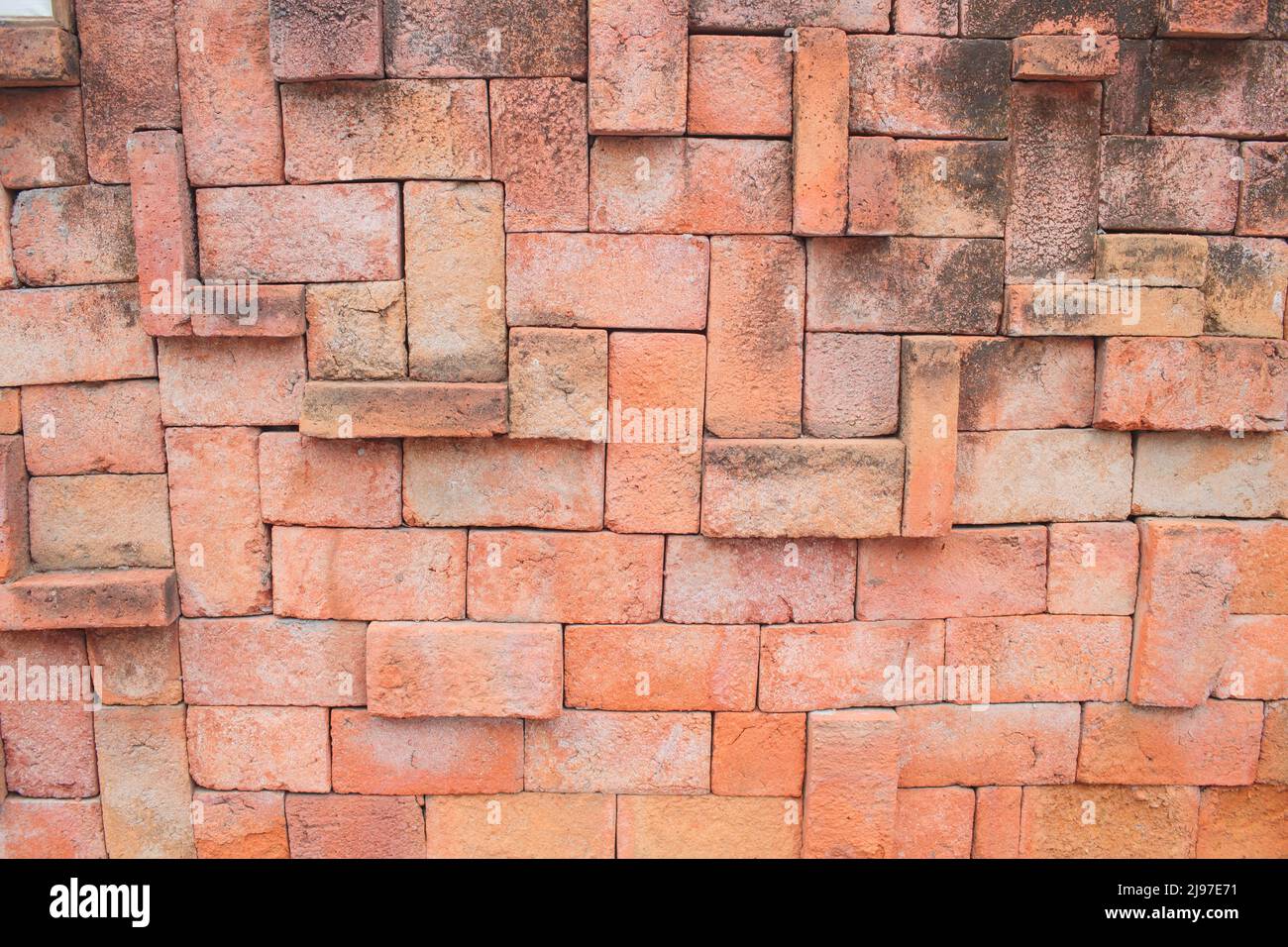 Brick wall background texture red protruding masonry Stock Photo - Alamy