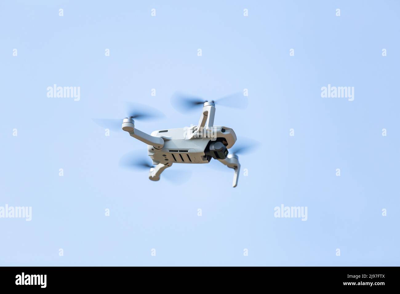 A mini drone flying through the air Stock Photo - Alamy