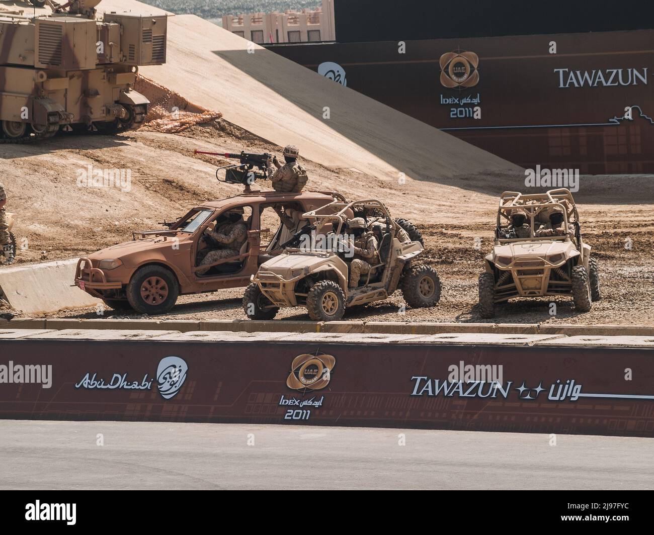 Abu Dhabi, UAE - Feb.23. 2011: UAE Armed forces BMW X3 and ATV (All ...