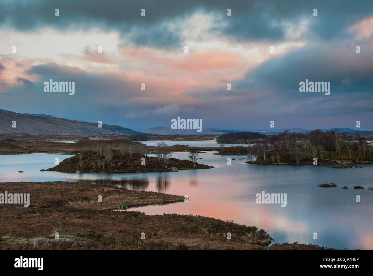 Beautiful colorful Winter sunrise landscape image across Rannoch Moor ...