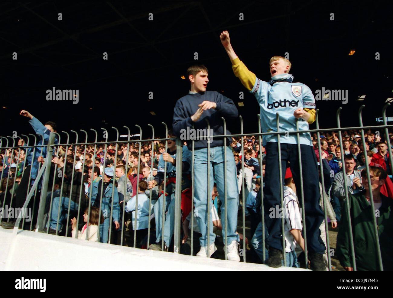 Manchester city fans on kippax stand hi-res stock photography and ...