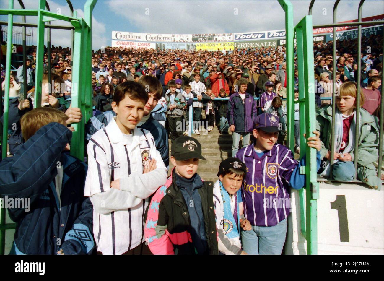 Manchester city fans on kippax stand hi-res stock photography and ...
