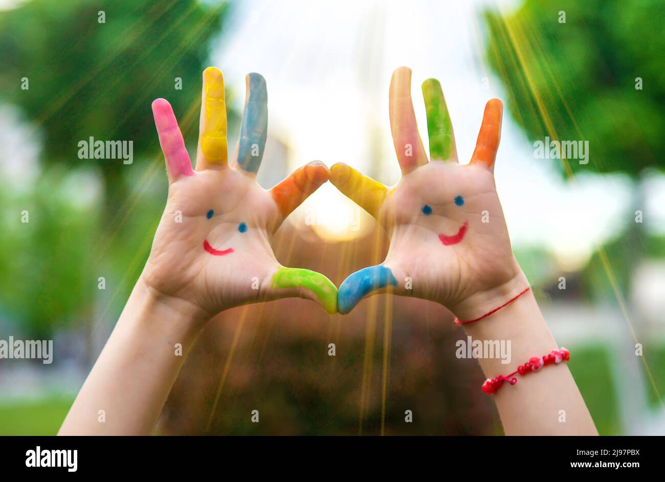 Hands of a child with a drawn smile. Selective focus Stock Photo - Alamy