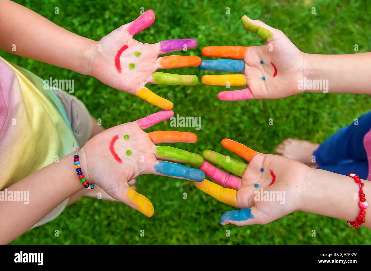 Hands of a child with a drawn smile. Selective focus Stock Photo - Alamy