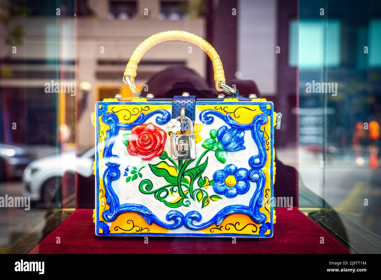 Dolce & Gabbana purse in the boutique window. The store is located in ...