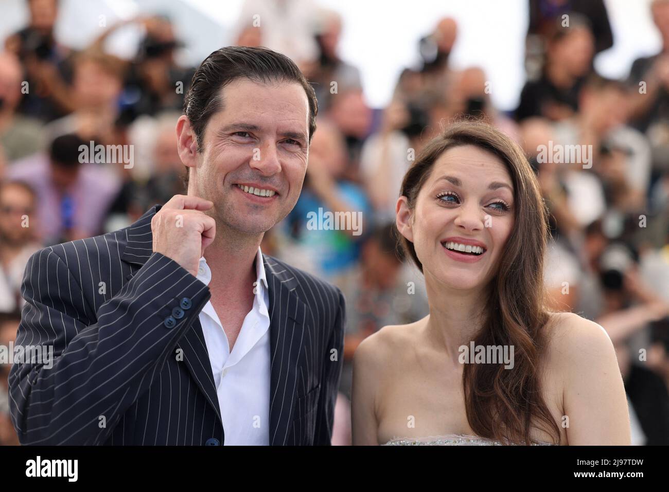 Cannes, France. 21st May, 2022. Melvil Poupaud, Marion Cotillard ...