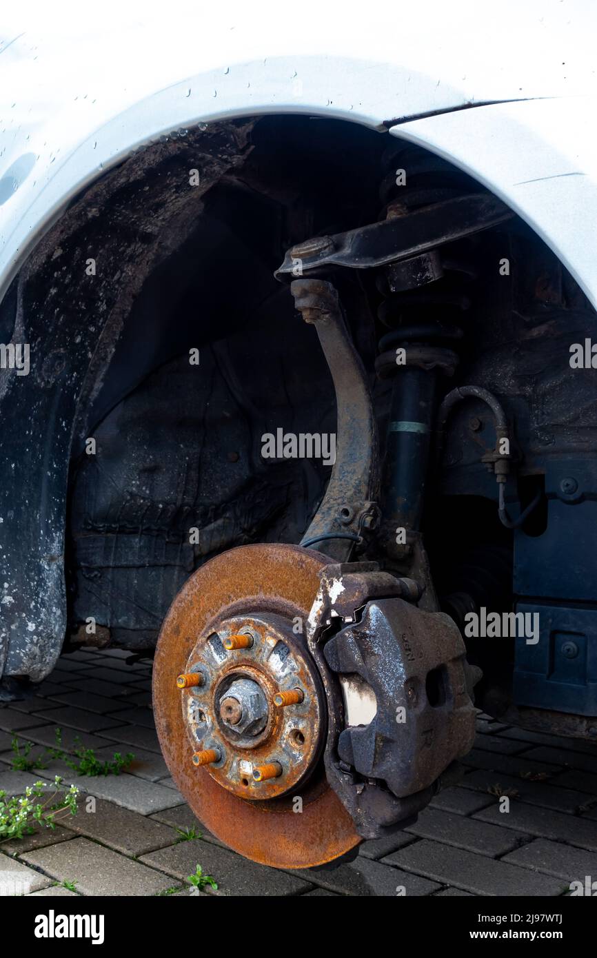 Rusty brake discs on an abandoned car. Object illuminated with soft ...
