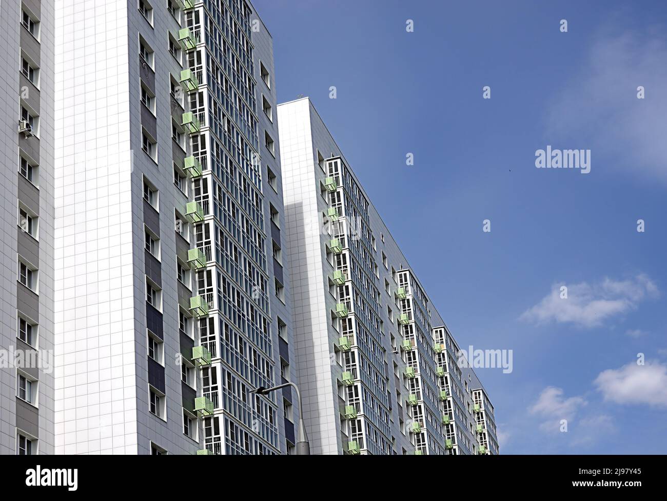 Big multi-storey block of flats with many apartments perspective view ...