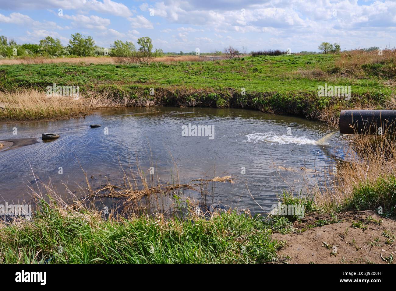 Draining sewage from pipe into river, pollution rivers and ecology ...