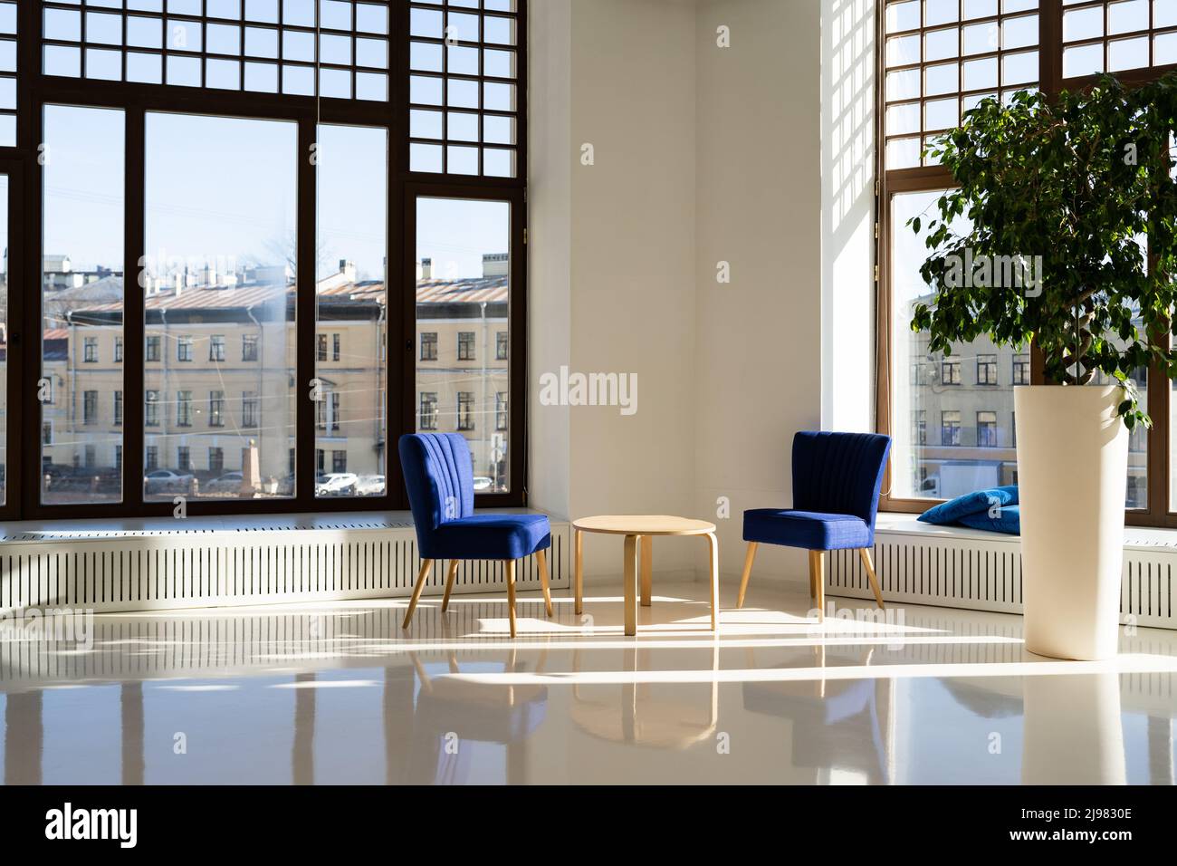 Sun shines through window on seat of modern cafe. Minimalism in ...