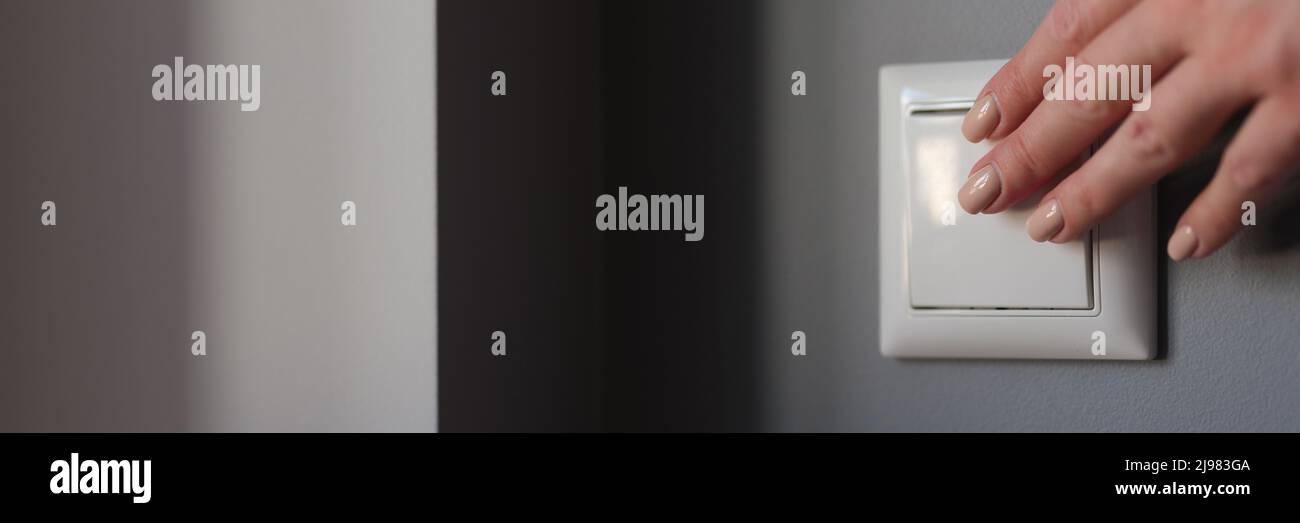 Hands push the switch on the wall, close-up Stock Photo - Alamy