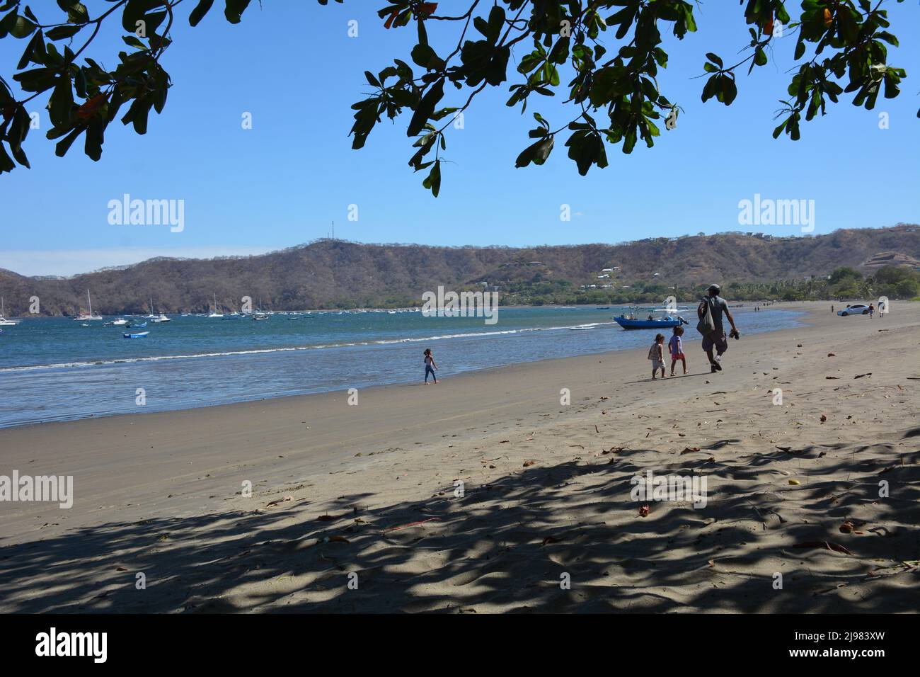 People on beach in Playa Coco, Costa Rica Stock Photo - Alamy