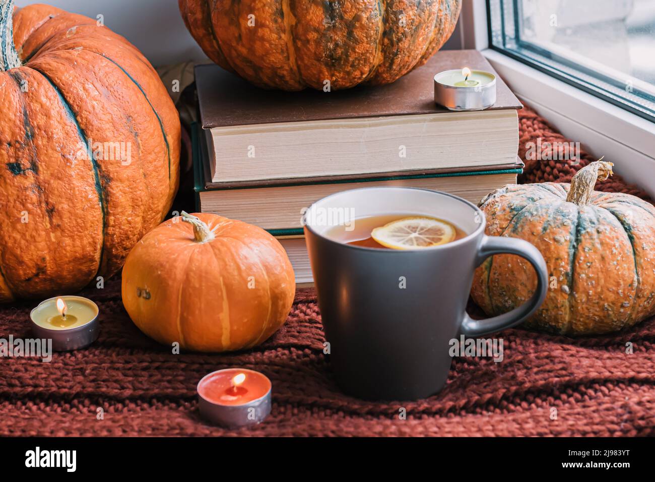 Cozy autumn still life. Books, Pumpkins and Cup of hot coffee on ...