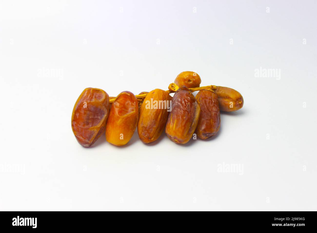 Tasty dry dates are isolated on white background. Arabic food Stock ...