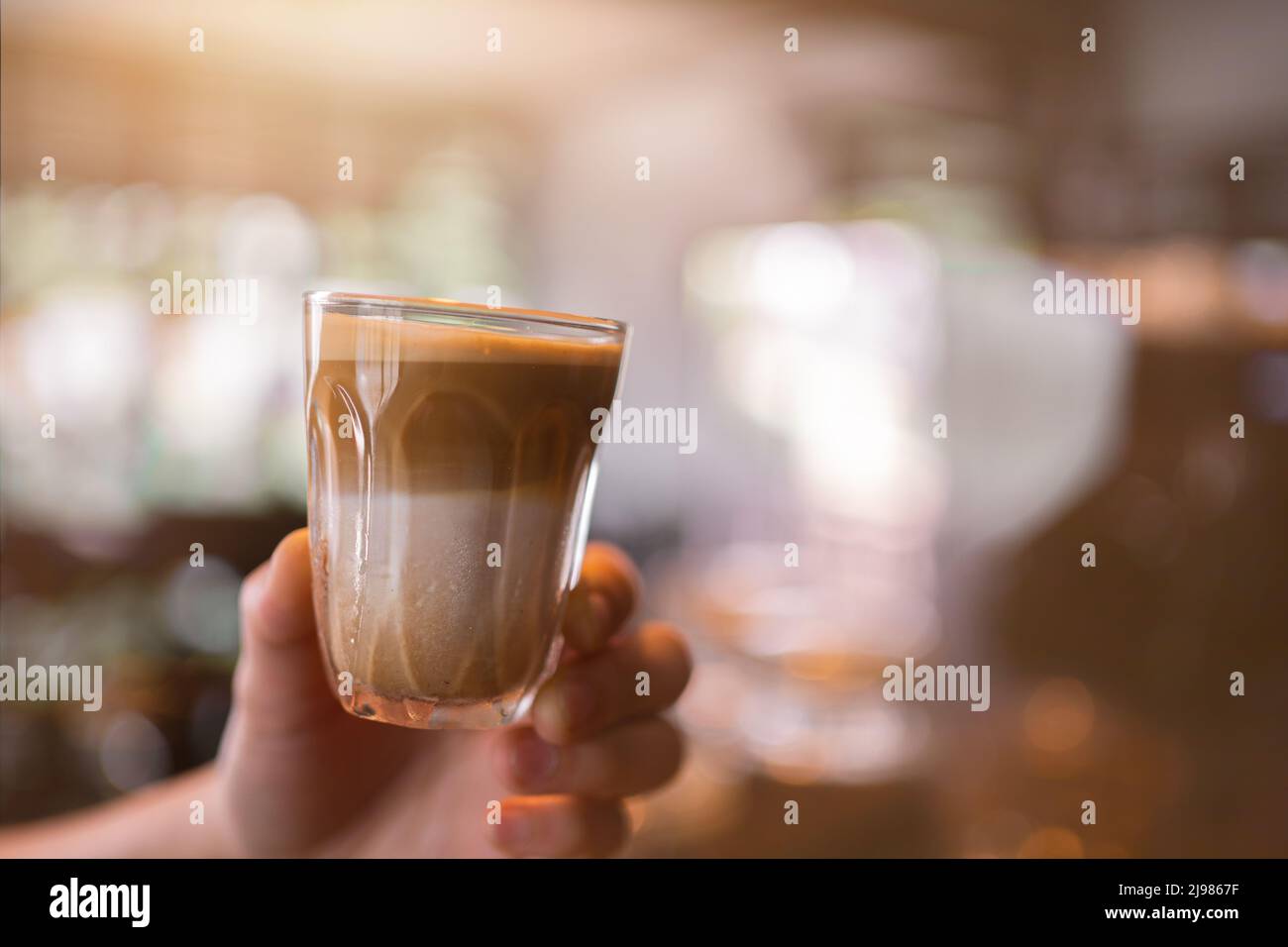 Beautiful speculoos latte with milk in a glass ,cafe background Stock ...