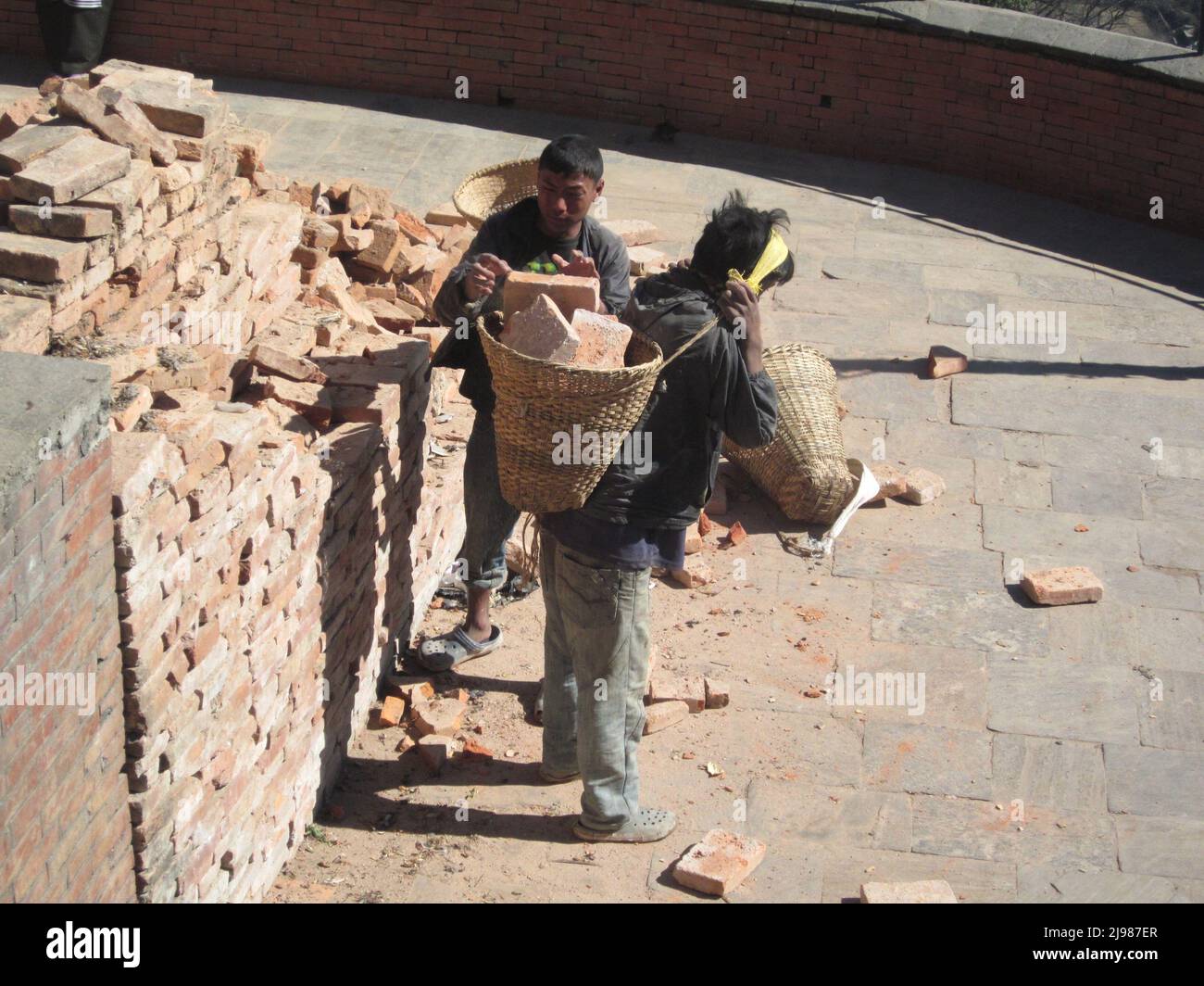 Monkey temple, Nepal. Men working hard Stock Photo - Alamy
