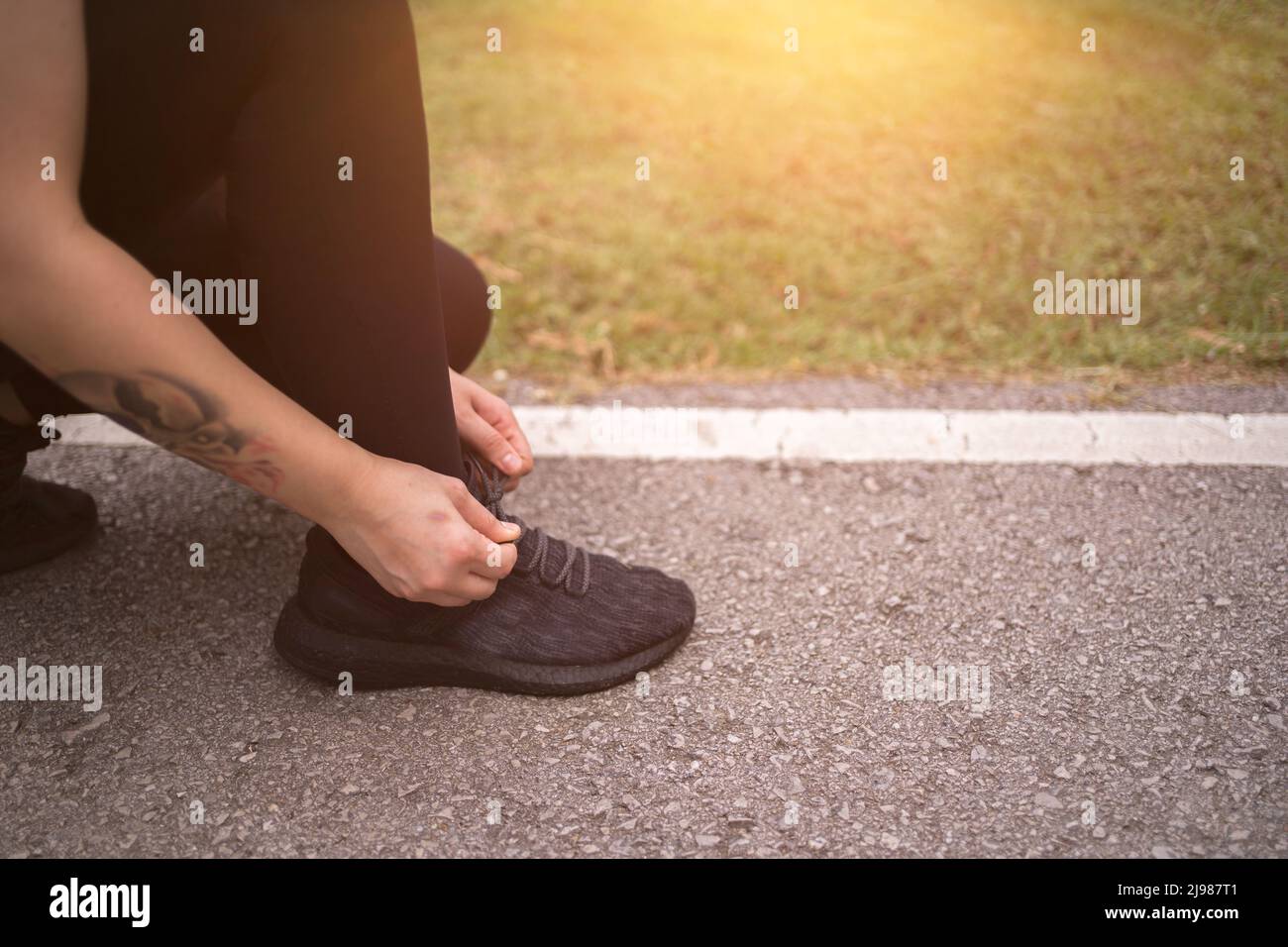 Athlete girl trying running shoes getting ready for jogging Stock Photo ...