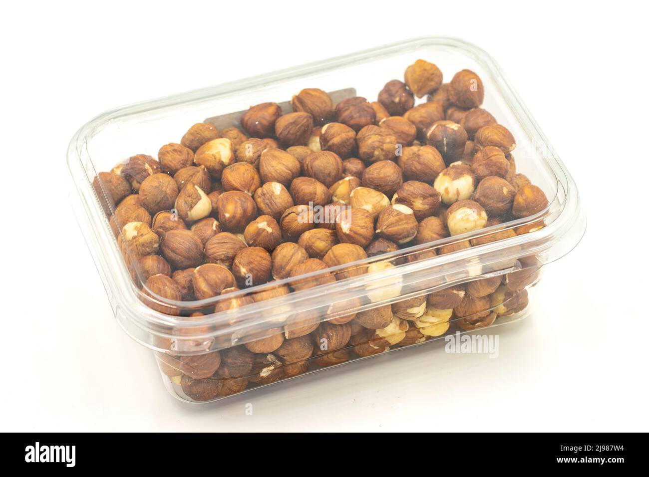 Packed hazelnut nuts isolated on white background. Organic nuts. close ...