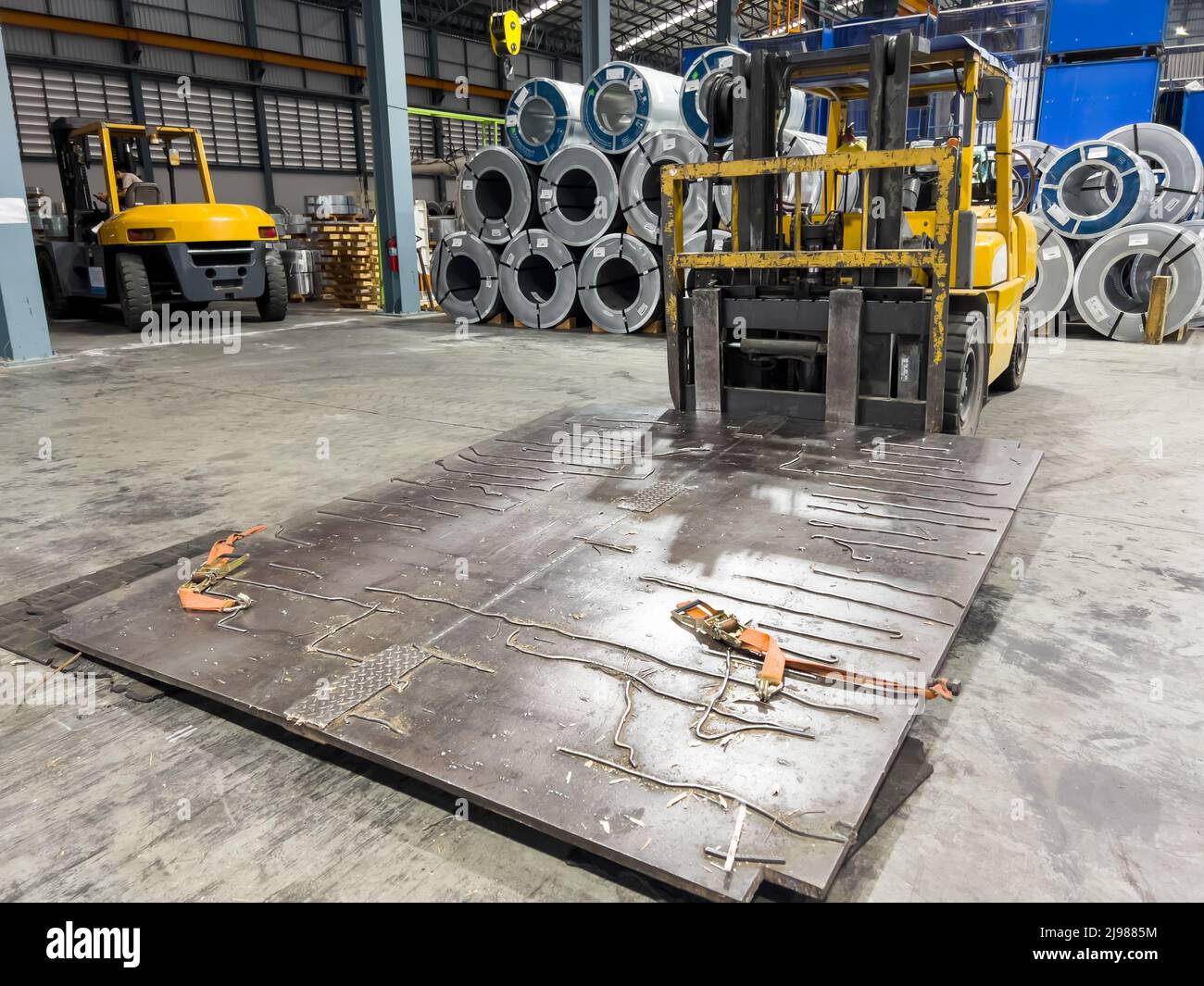 Forklift loader. Iron pallet equipment at warehouse. roll steel ...