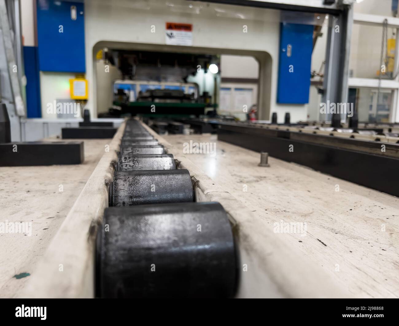roller conveyor for move mold to press machine Stock Photo - Alamy