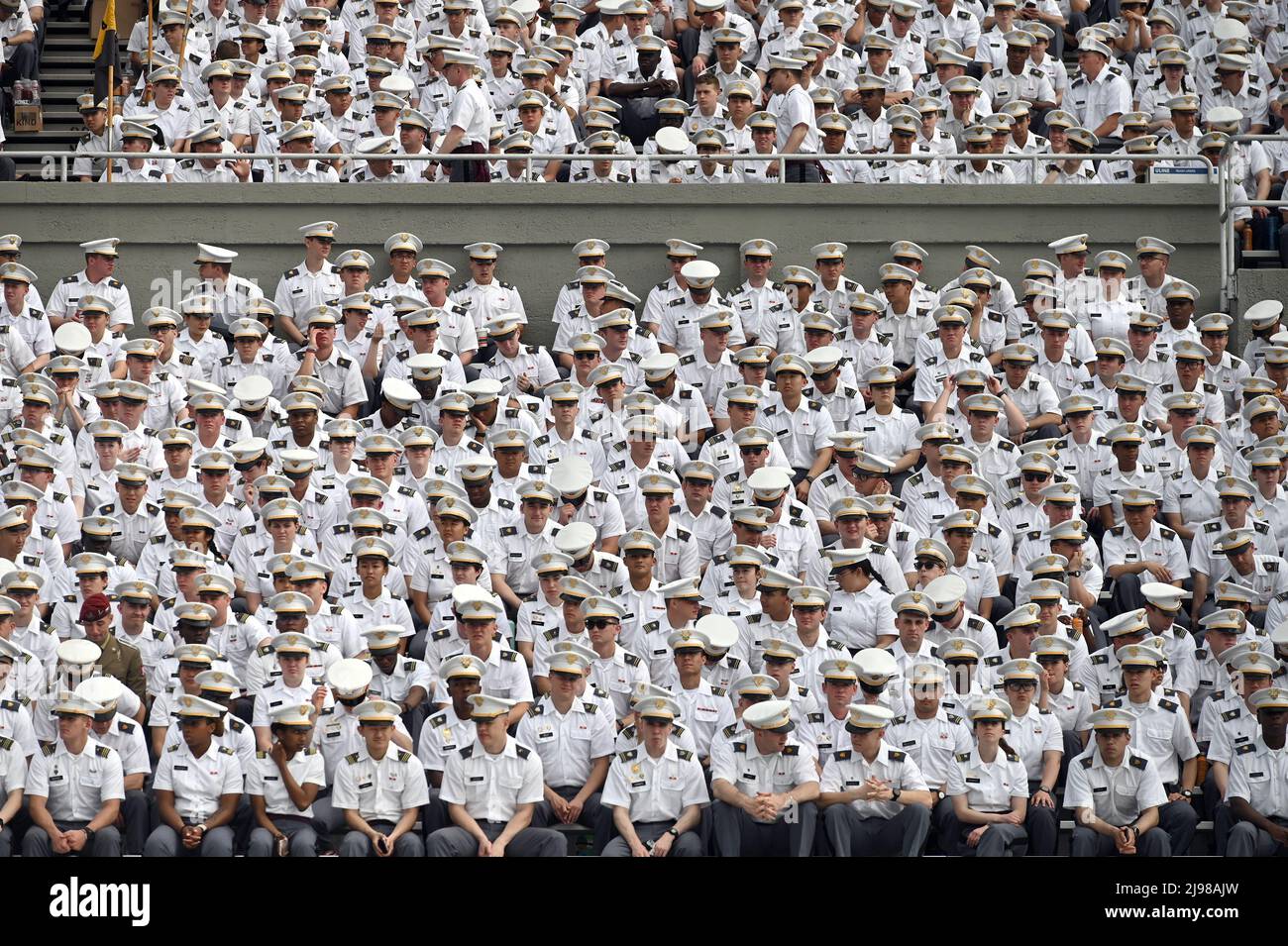 Non-graduates watch their fellow USMA Corps of Cadets arrive inside ...