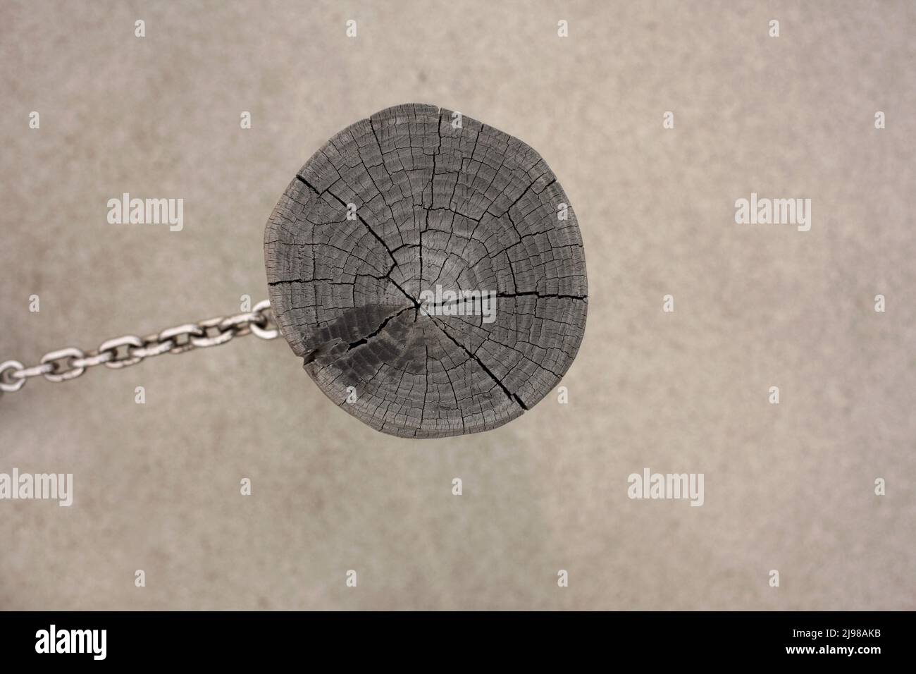 Wooden posts with chain for decorative fencing Stock Photo - Alamy