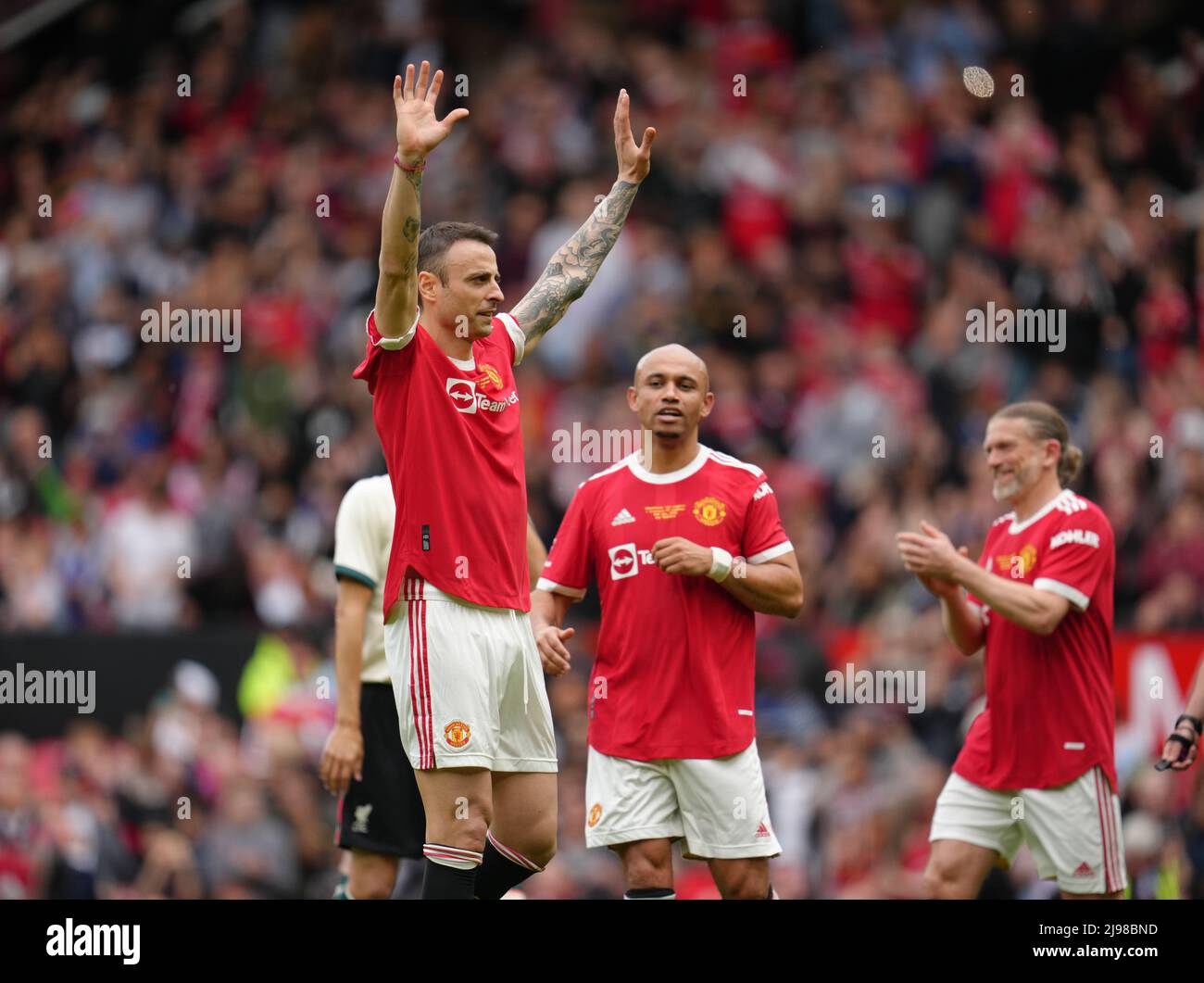 Manchester United Legends’ Dimitar Berbatov aknowledges the fans during the Legends match at Old ...