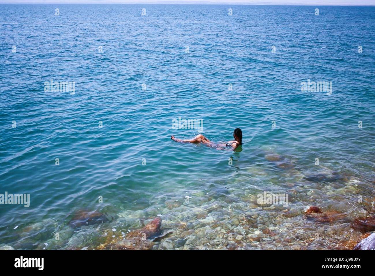 Floating on the dead sea Stock Photo - Alamy