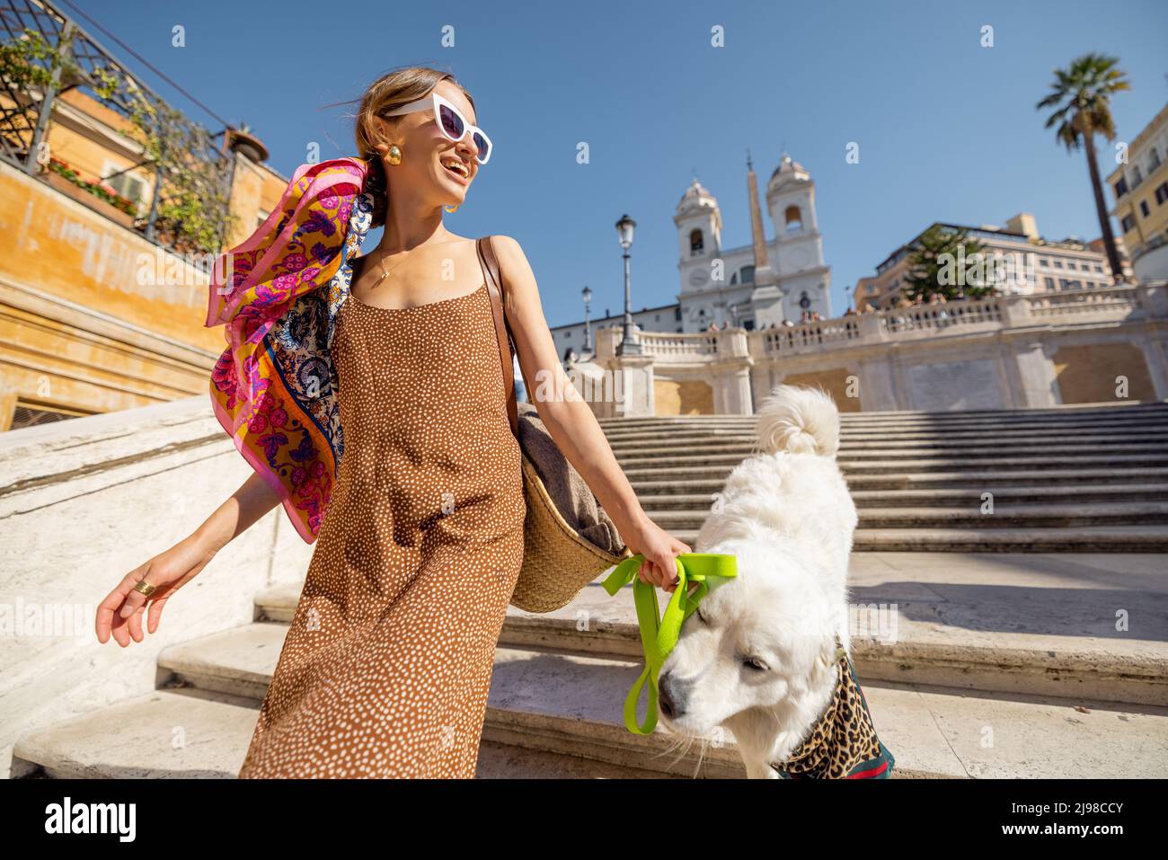 Woman running with her dog on famous Spanish steps in Rome Stock Photo ...