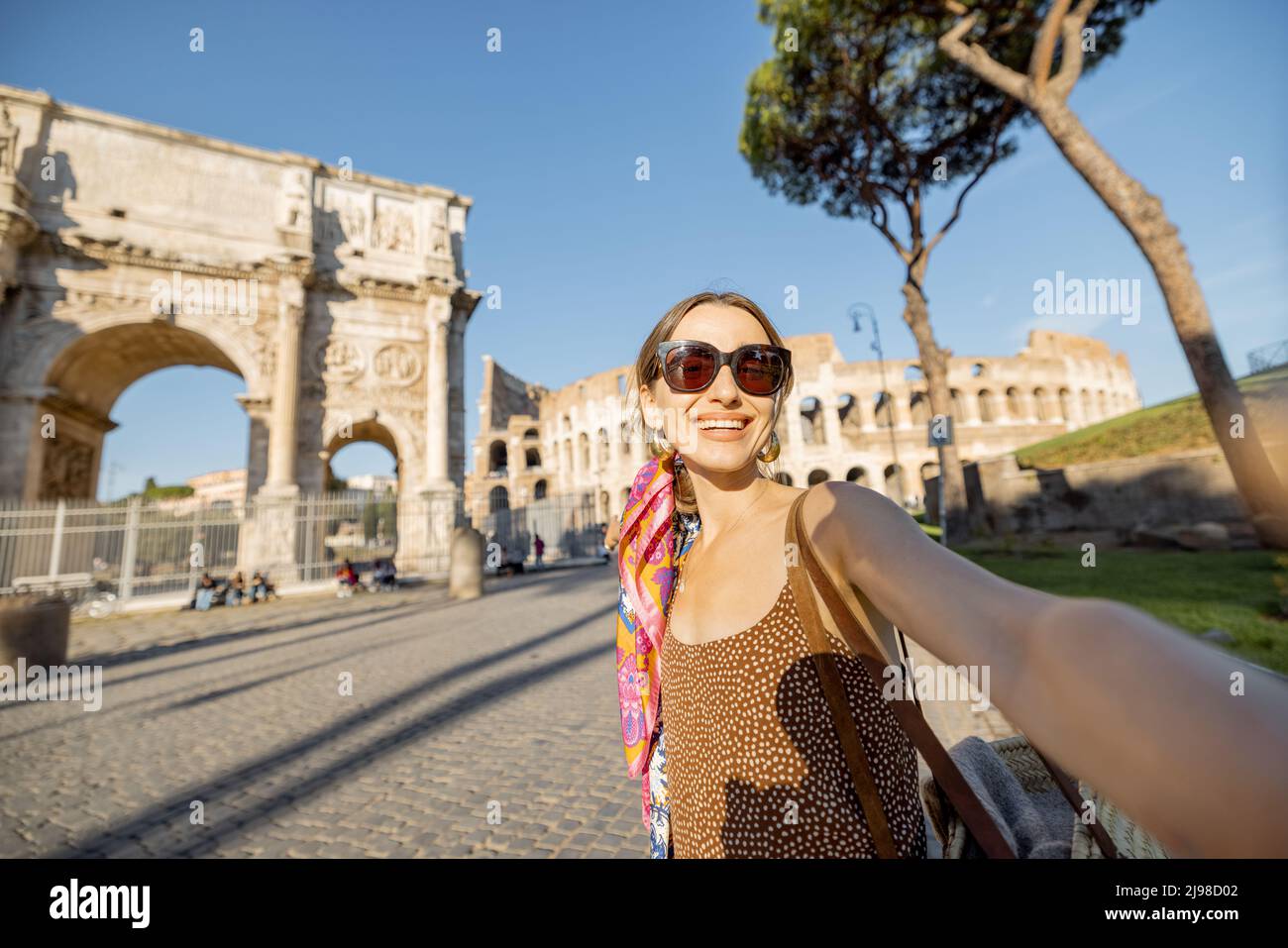 Woman in front of Coliseum in Rome Stock Photo - Alamy