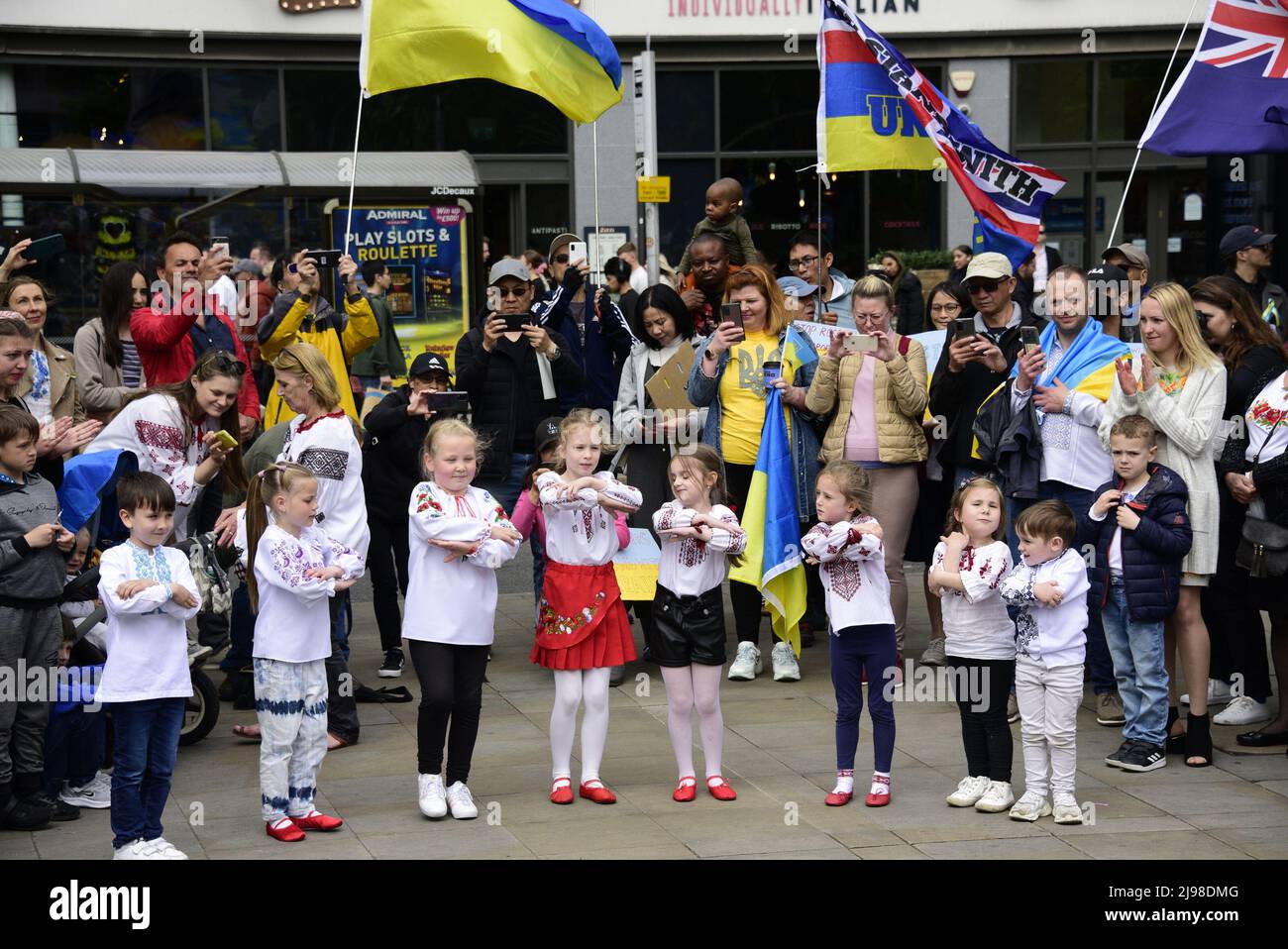 Manchester, UK, 21st May, 2022. Young children in embroidered shirts ...
