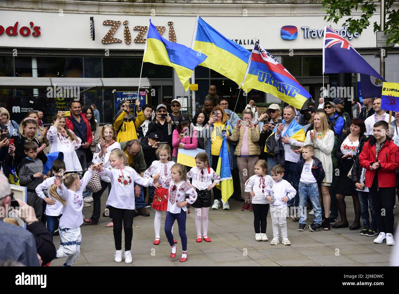 Manchester, UK, 21st May, 2022. Young children in embroidered shirts ...