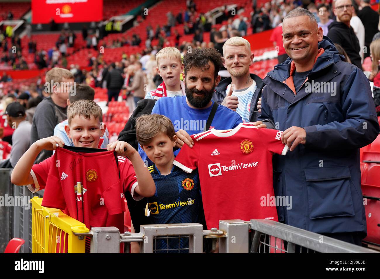 Manchester United fans pose inside the stadium during the Legends match ...