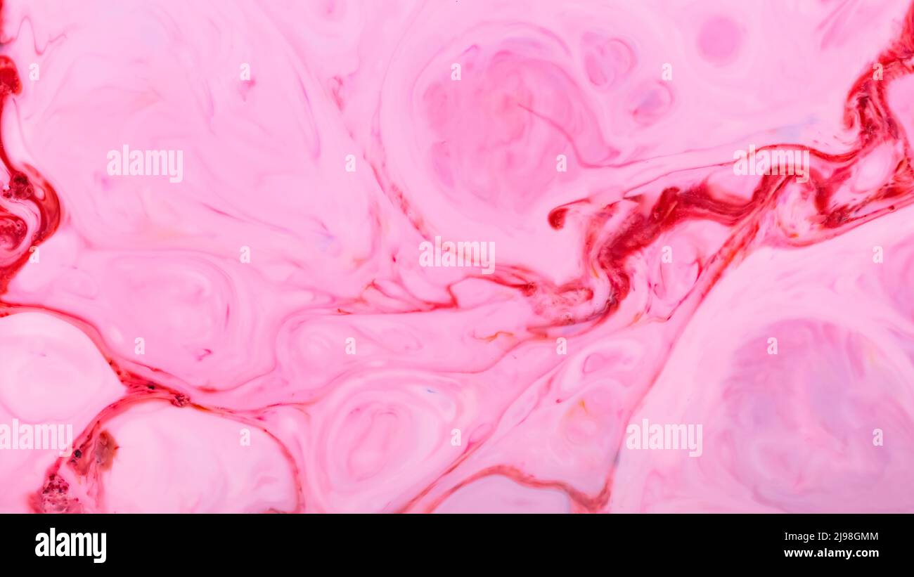 Pink liquid abstract surface. Colorful spots on a water surface. Fluid ...