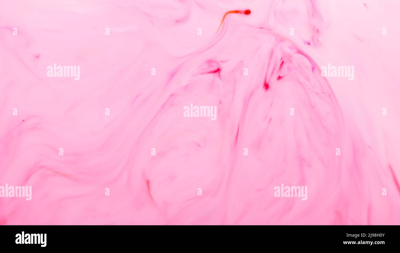 Light pink fluid art background. Blurred pink shapes on a liquid ...