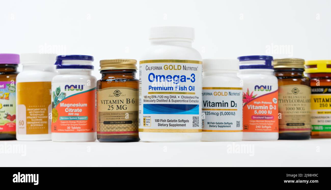 A lot of jars with dietary supplements on a white background, a long ...