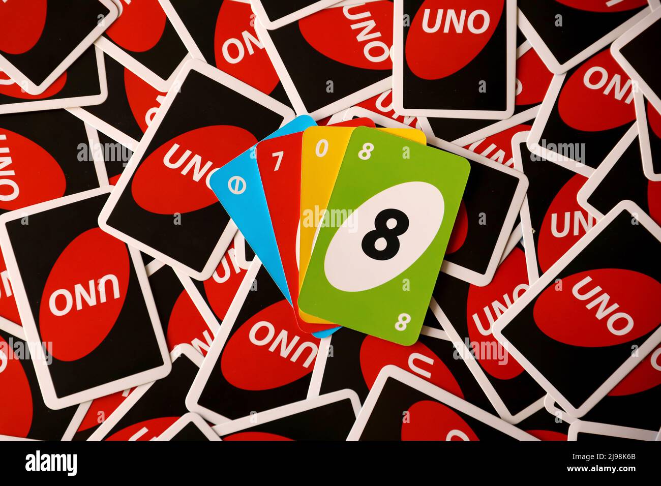 TERNOPIL, UKRAINE - MAY 15, 2022: Many colorful UNO game cards. UNO is ...
