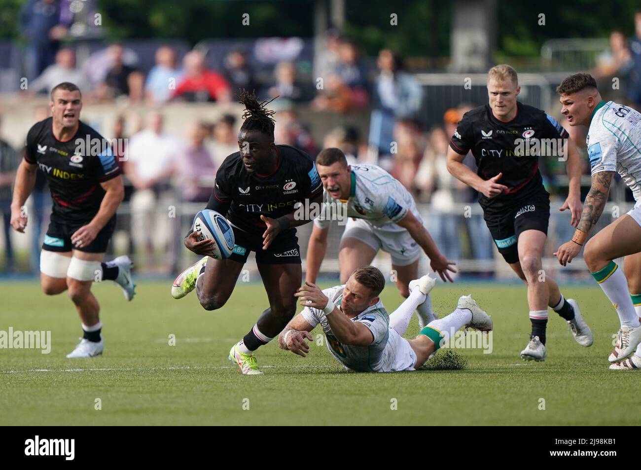 Saracens’ Rotimi Segun gets away from Northampton Saints’ Dan Biggar ...