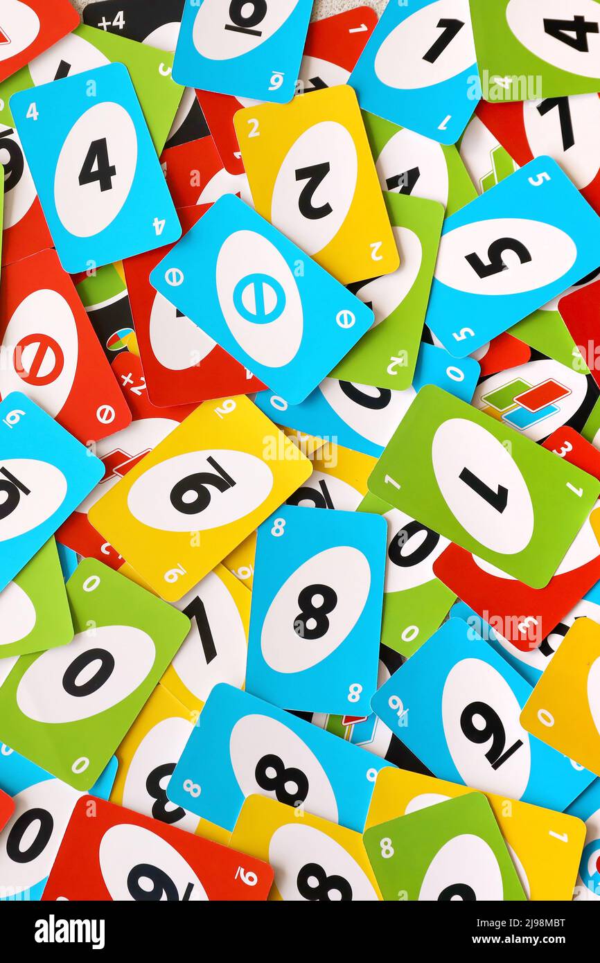 TERNOPIL, UKRAINE - MAY 15, 2022: Many colorful UNO game cards. UNO is ...